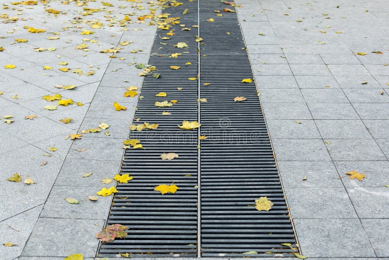 Grating of the Drainage Storm System on the Pedestrian Sidewalk. Stock ...