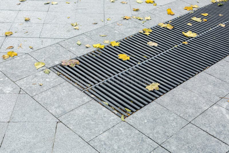 Grating of the Drainage Storm System on the Pedestrian Sidewalk. Stock ...