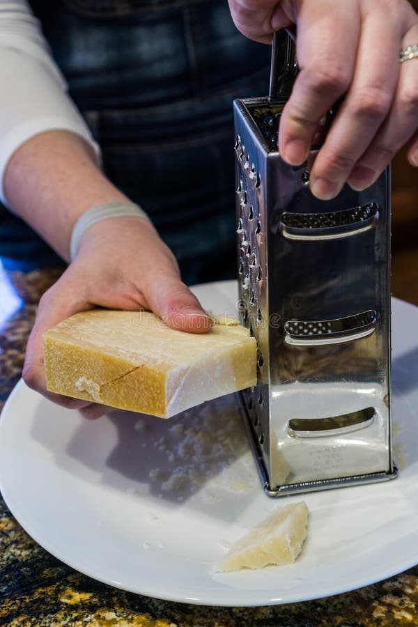 Grating fresh cheese stock image. Image of ingredient - 67437415