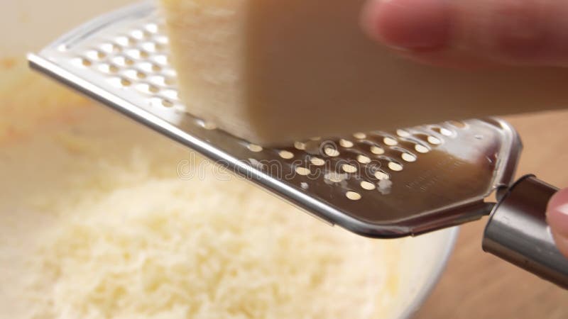 Grating Fresh Cheese Over Bowl Close-up. Stock Footage - Video of ...
