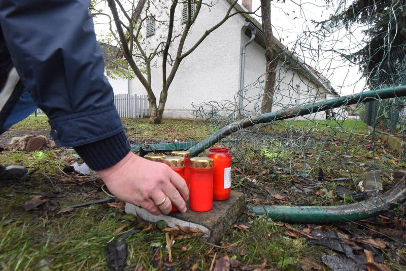 Grave candle at a funeral stock photo. Image of mourners - 374257940