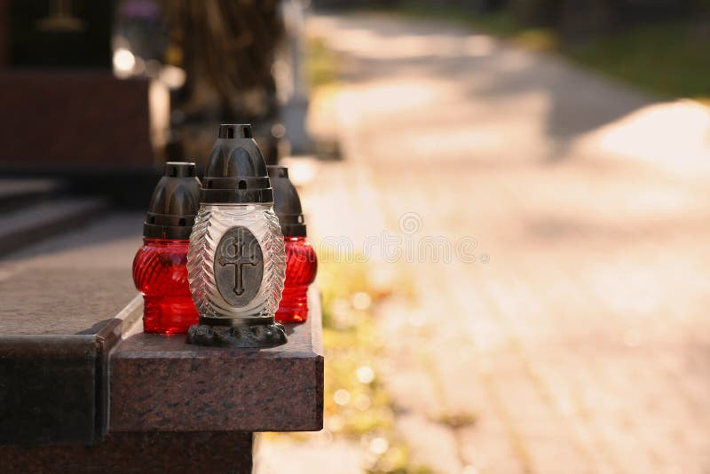 Grave Lanterns on Granite Surface in Cemetery, Space for Text Stock ...