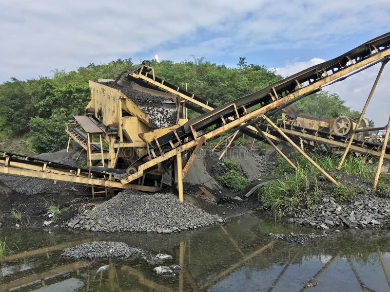 Gravel extracting at river stock image. Image of industrial - 94273189