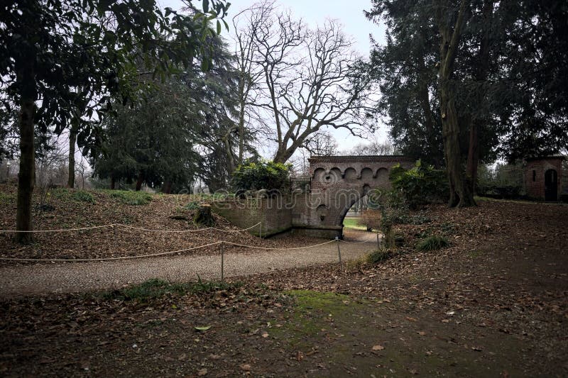 Gravel Path that Passes Under a Brick Bridge in a Park Stock Photo ...