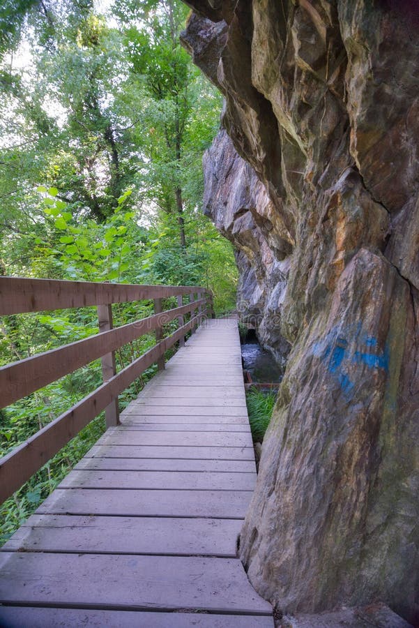 Gravel Pathway Next To the Rocky Wall in a Park Stock Photo - Image of ...
