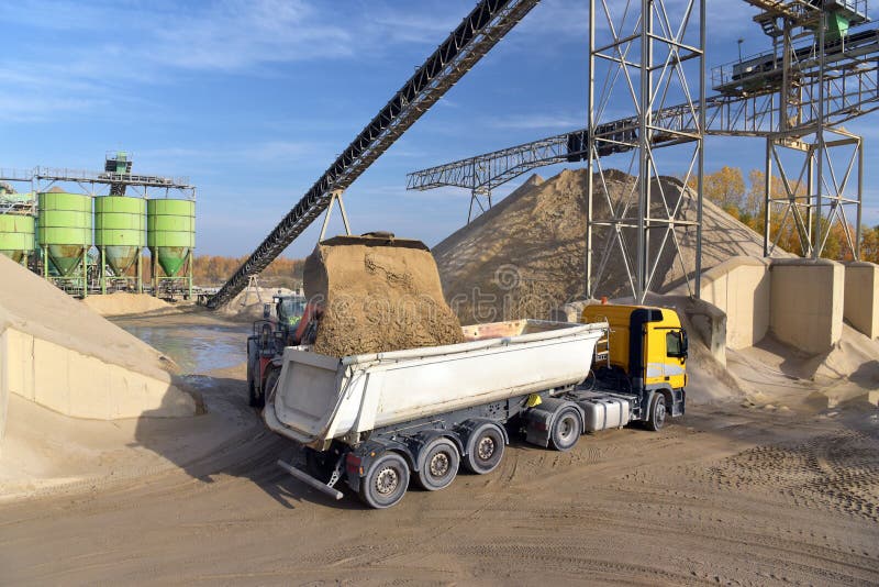 Gravel Pit: Building and Wheel Loader Loading Gravel Onto a Truck Stock ...