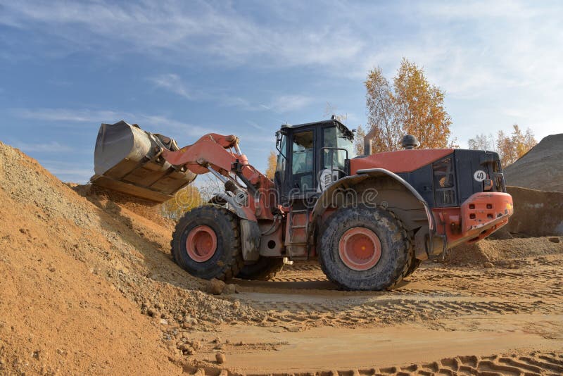 Gravel Pit: Building and Wheel Loader Loading Gravel Onto a Truck Stock ...