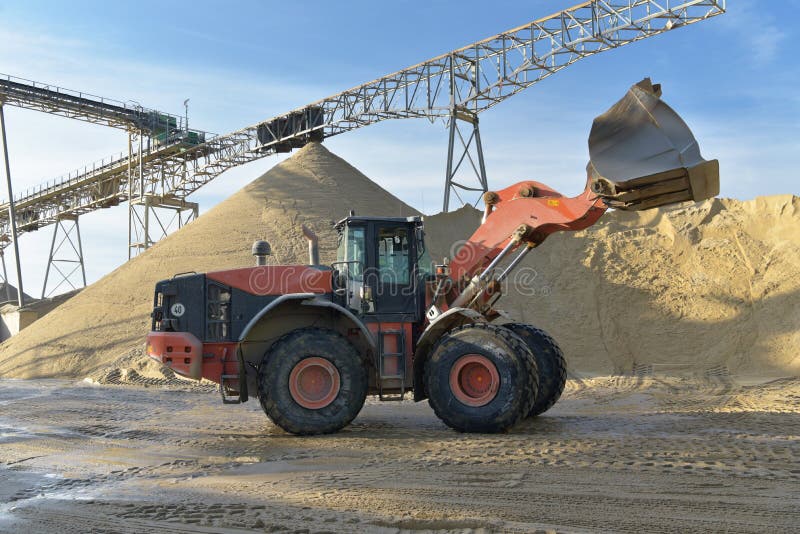 Gravel Pit: Building and Wheel Loader Loading Gravel Onto a Truck Stock ...