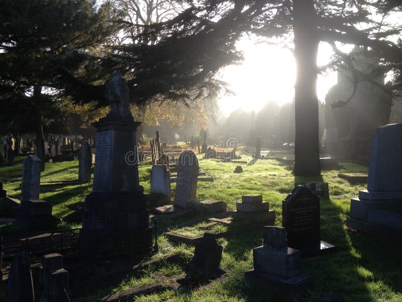 Graveyard in sunlight editorial image. Image of misty - 75891890
