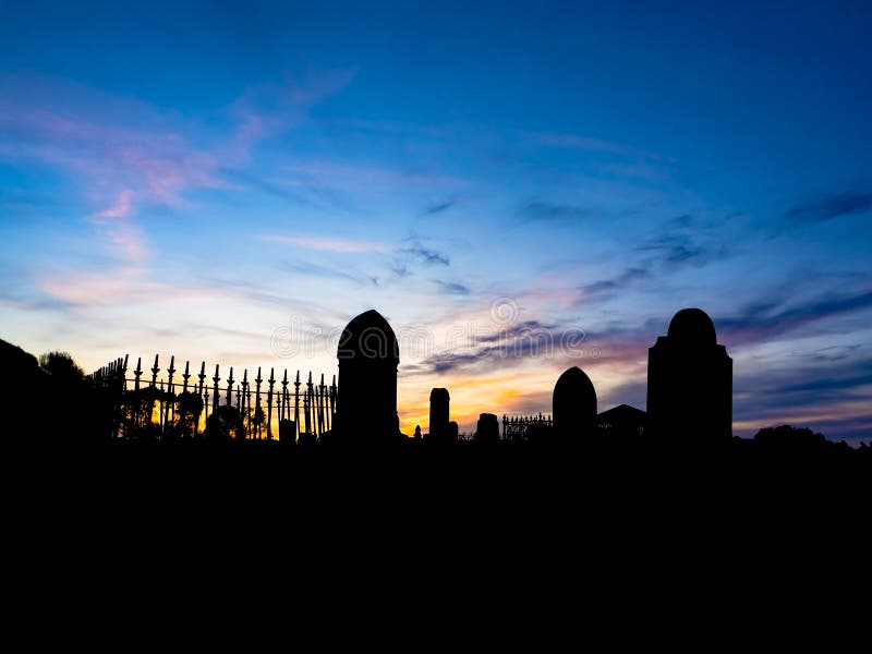 Graveyard at sunset stock image. Image of cloud, tombstone - 56379191