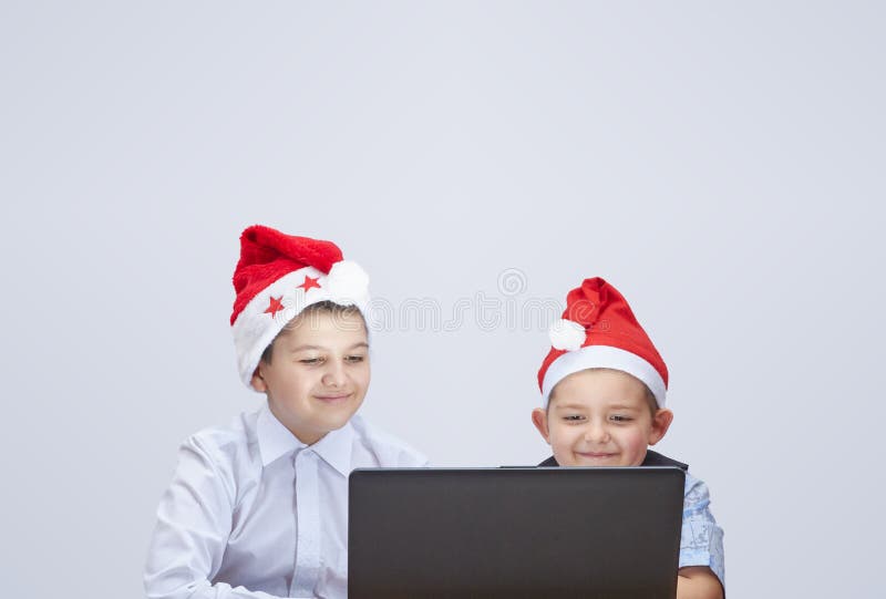 On a Gray Background the Boys Looking at a Laptop Stock Image - Image ...