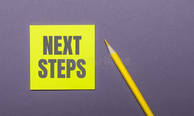 On a Gray Background, a Bright Yellow Pencil and a Yellow Sticker with ...