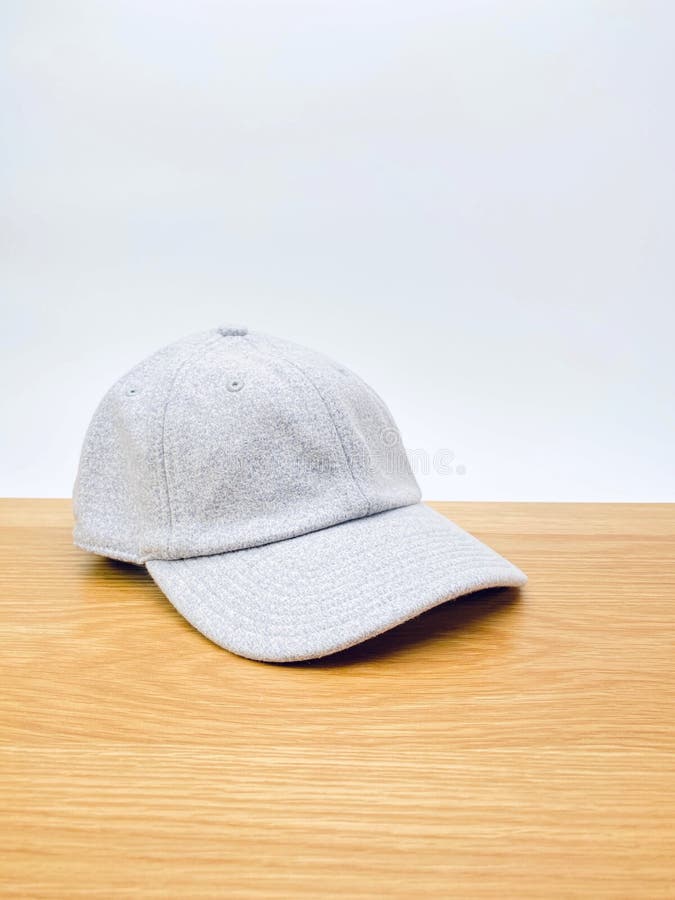 Baseball cap on table stock image. Image of cloth, baseball - 241652491