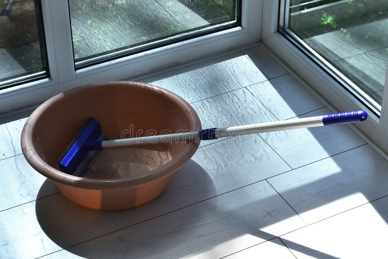 A Gray Blue Brush for Washing Windows Lies in the Water Stock Image ...