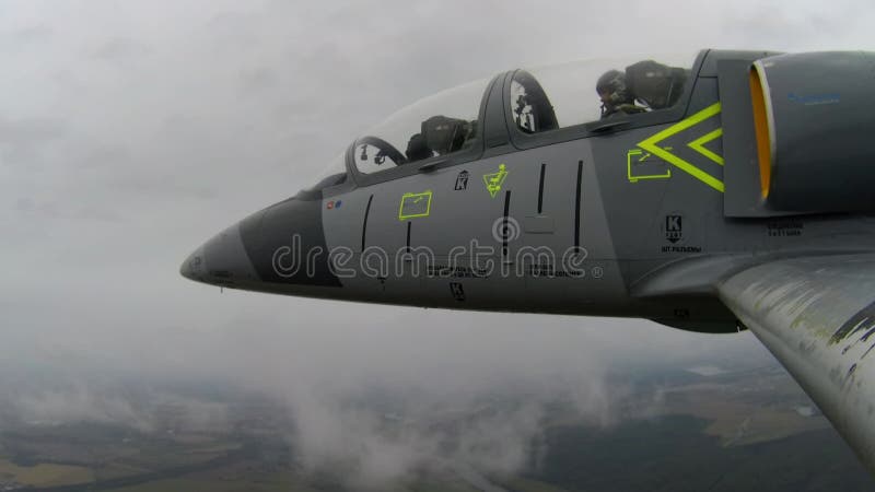 A Gray Blue Combat Plane Fly through White Thick Clouds. the Fighter is ...