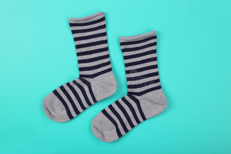 Gray Blue Navy Stripes Socks on Green Pastel Background Stock Photo ...