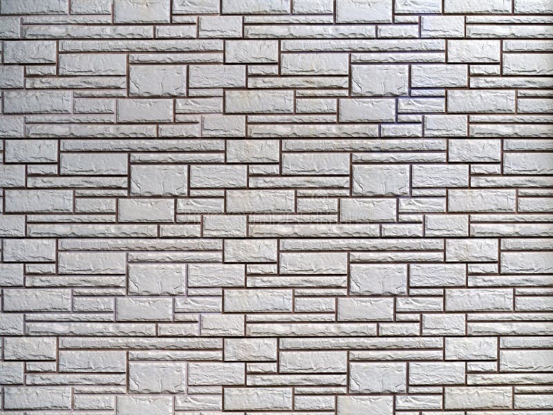 The Gray Brick Wall Consists of Rough Decorative Bricks of Various ...