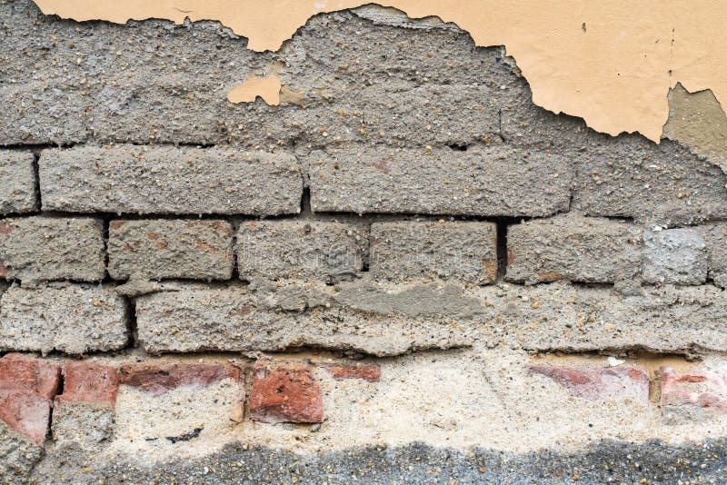 Gray Brick Wall and Pieces of Plaster Closeup Background Urban Stock ...
