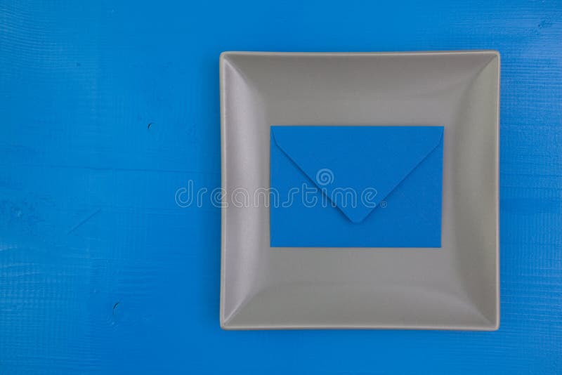 Gray Ceramic Dish with Envelope on the Wooden Table Stock Photo - Image ...