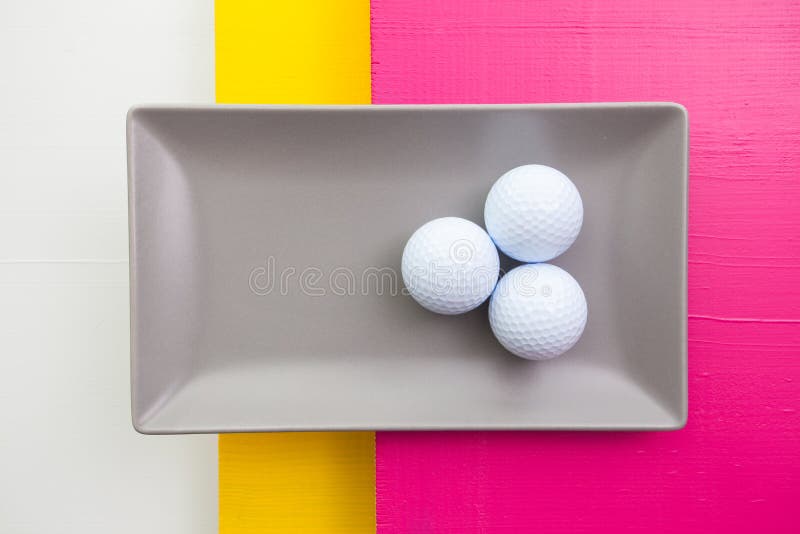 Gray Ceramic Dish with Golf Balls Stock Image - Image of golfing, cook ...