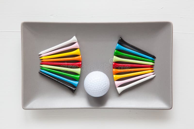 Gray Ceramic Dishes with Golf Balls and Wooden Tees Stock Photo - Image ...