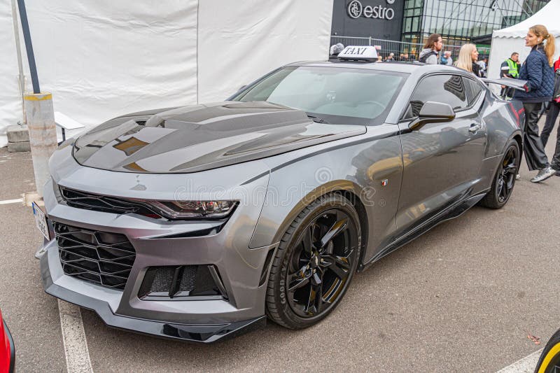 A Gray Chevrolet Camaro on Display at an Auto Show, Featuring a Sleek ...