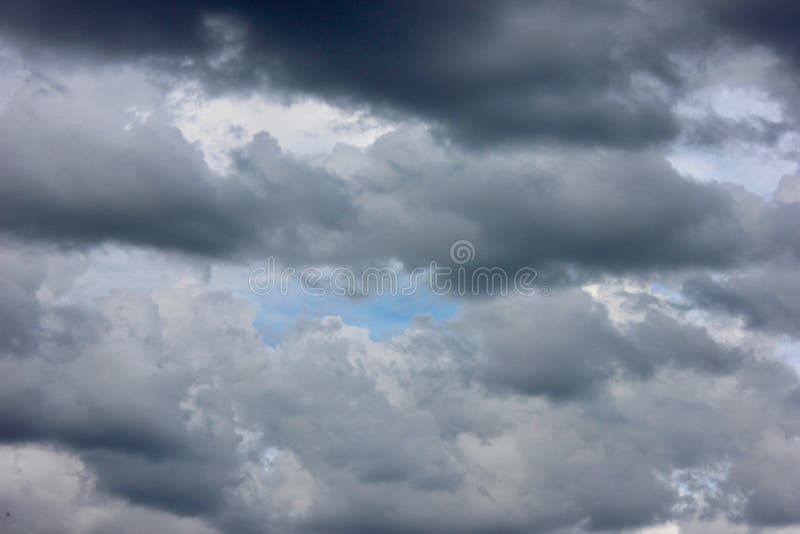 Gray clouds in a blue sky stock photo. Image of natural - 100803450