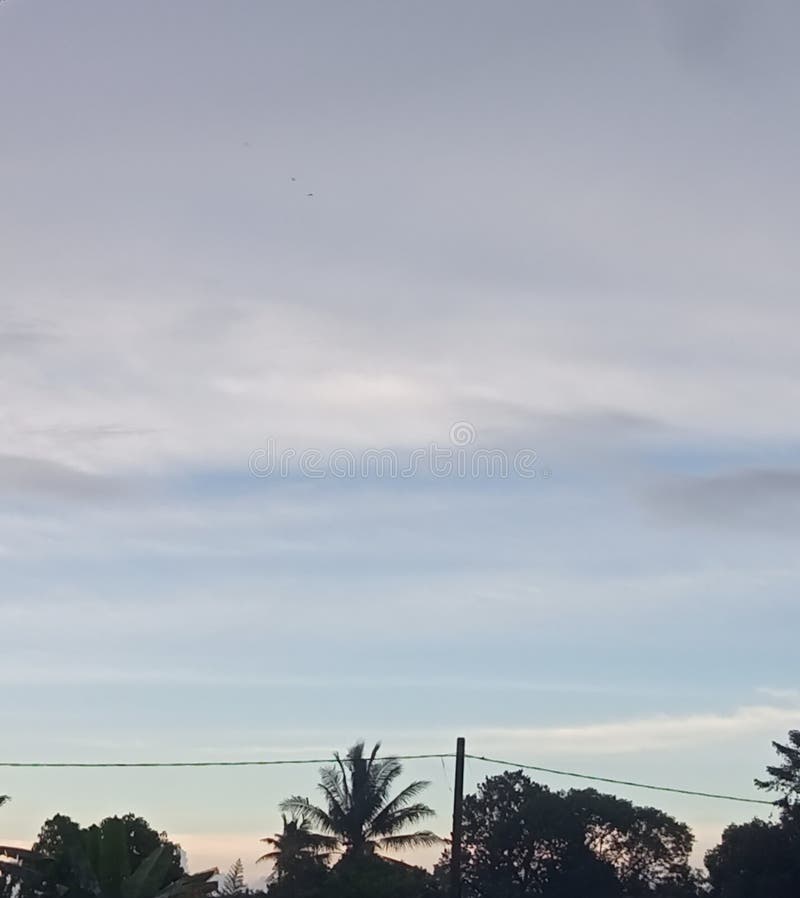 Gray Clouds and Silhouettes Stock Image - Image of vehicle, lighting ...