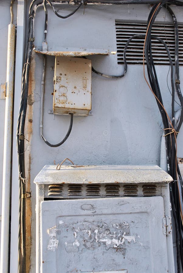 Gray Color Painted Iron Electricity Box with Black Cables Hanging on ...