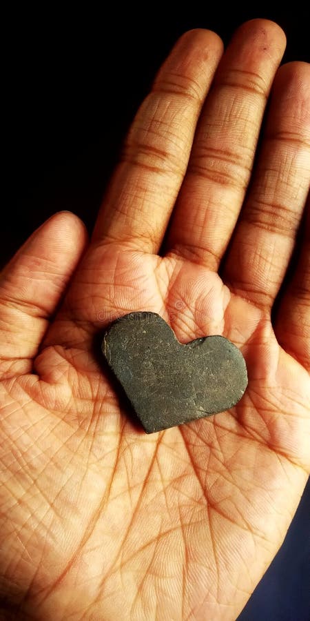Gray Colour Heart Stone on the Hand Stock Image - Image of gray, artist ...