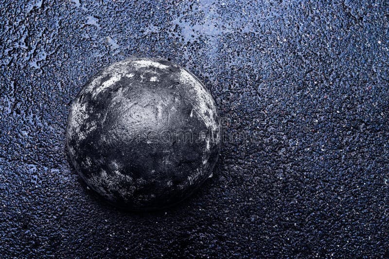 Gray Concrete Ball on Wet Dark Pavement. Stock Image - Image of detail ...