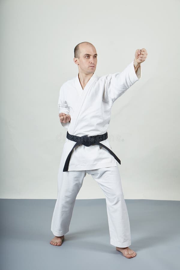 On a Gray Cover, an Adult Athlete Does Formal Exercise Stock Image ...