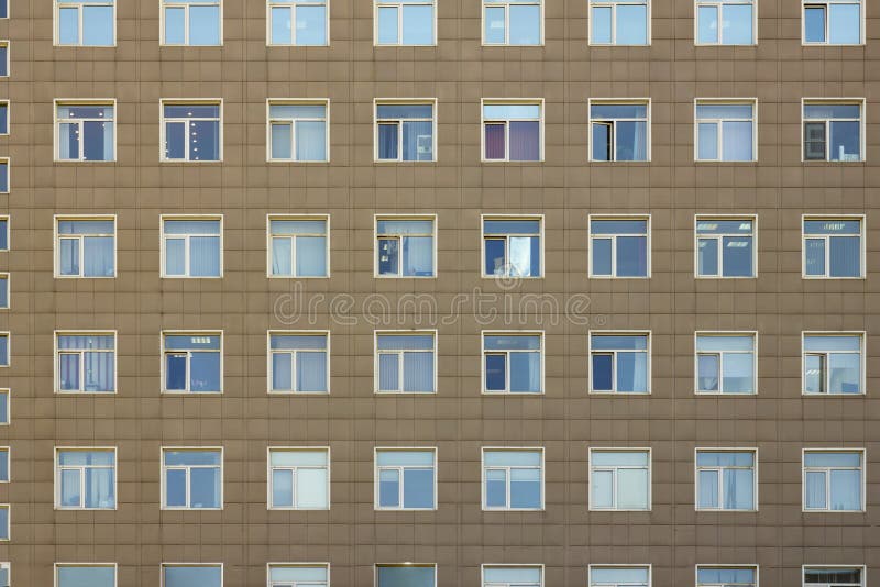 The Gray Facade of a High-rise Multi-storey Office Building with White ...