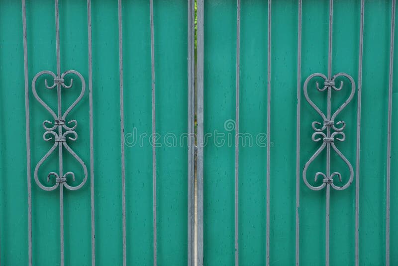 Gray Forged Pattern of Steel Rods on an Iron Green Fence Stock Photo ...