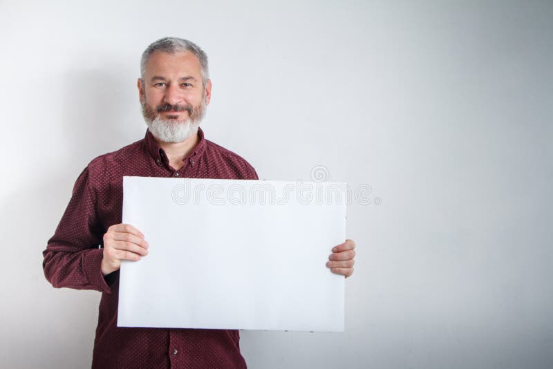 Gray-haired Man with a Beard Holding White Empty Signboard with Space ...