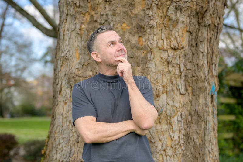 Gray-haired Man Standing in Front of a Tree Stock Photo - Image of ...