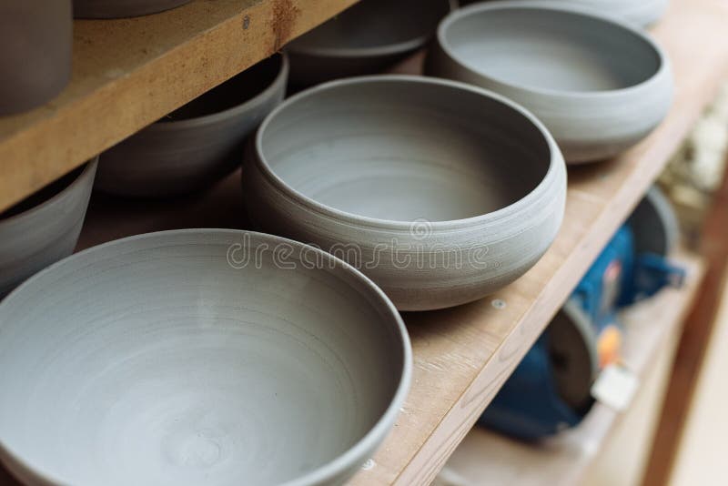 Gray Handmade Ceramic Plates. Glazed Clay Plates in a Pottery Workshop ...