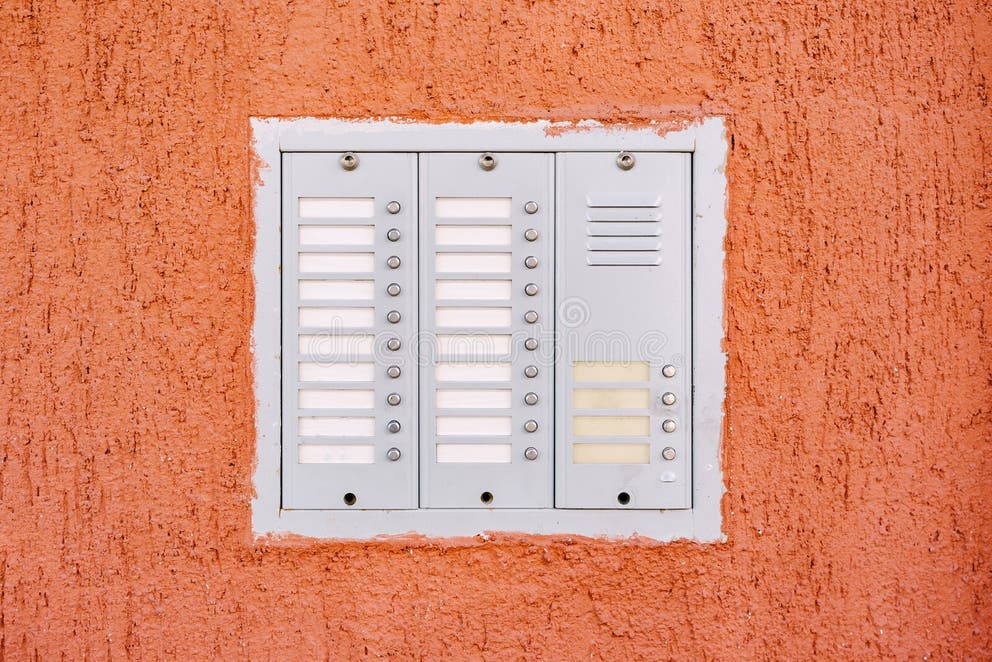 A Gray Intercom on an Orange Rough Wall. Stock Image - Image of ...