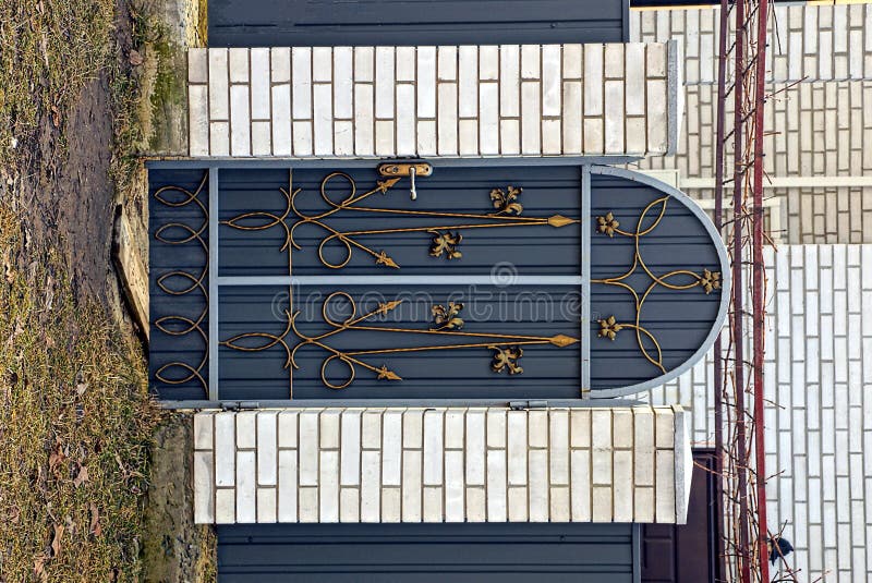 Gray Iron Gate with Brick Fence Stock Image - Image of metal, wooden ...