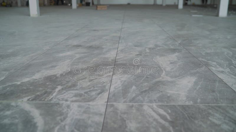 Gray Marble Tile Flooring Installation in a Modern Building Stock ...