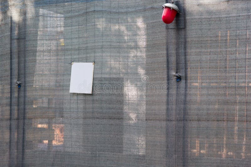 Gray Mesh Fence with Red Lantern on Building Site Stock Photo - Image ...
