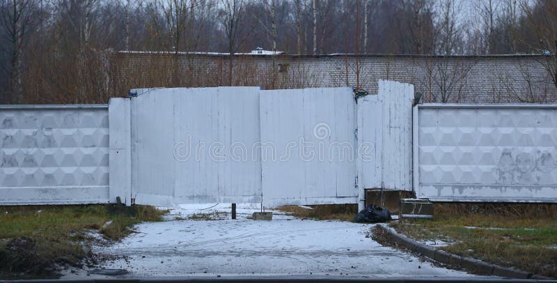 Gray Metal Gate in Concrete Fence Stock Photo - Image of outdoor ...