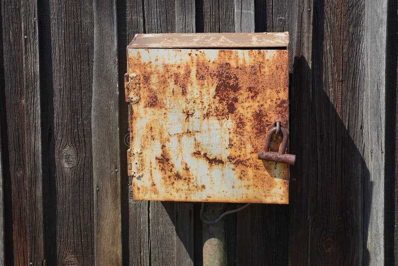 Metal Rusty Square Box Against a Wooden Wall Stock Image - Image of ...