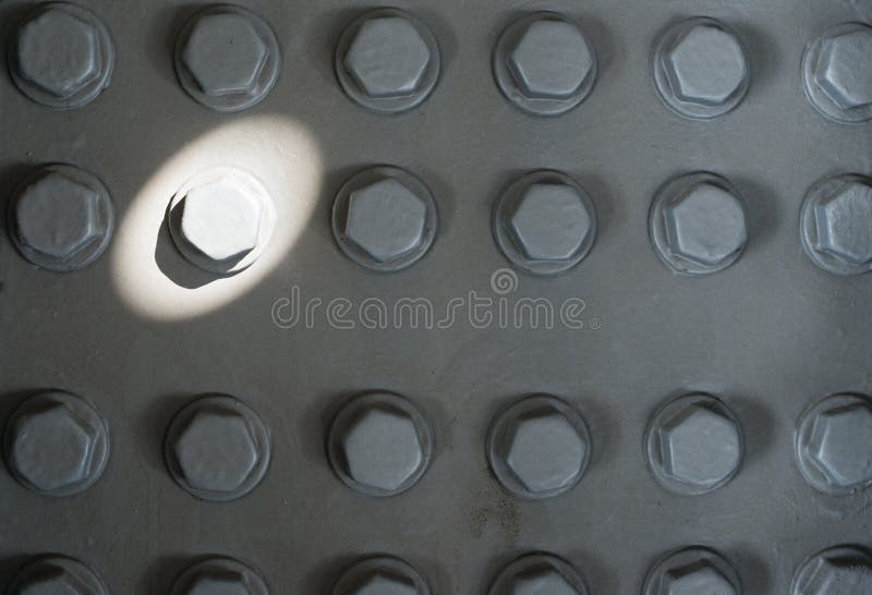 Gray Metal Surface with Bolts and Spot of Sunlight Stock Image - Image ...