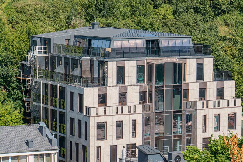 Gray, Minimalistic Multi-level Apartment Building with Geometric Shapes ...