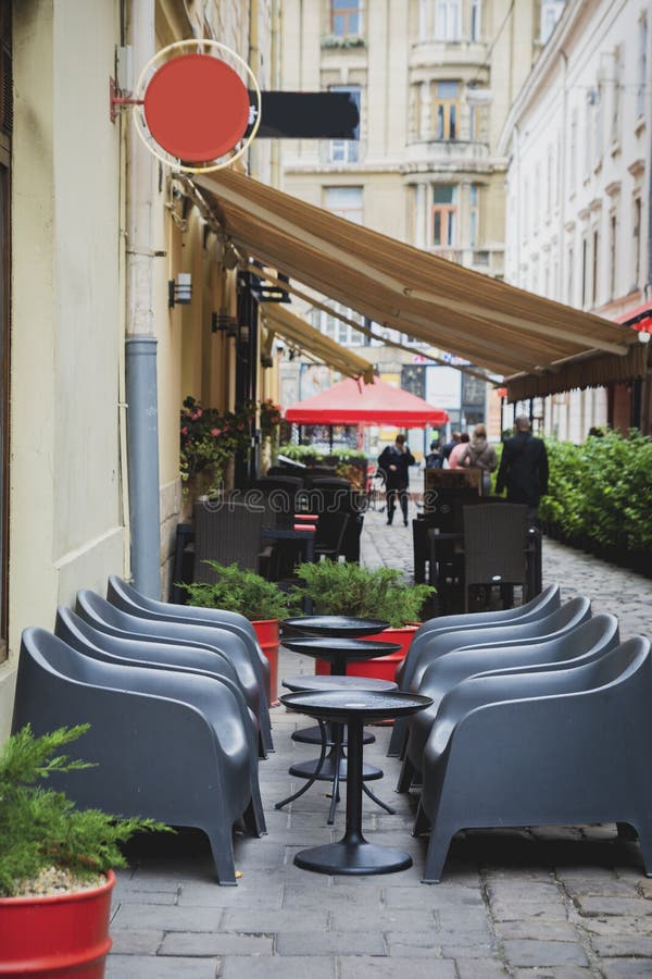 Gray outdoor cafe chairs stock photo. Image of lifestyle - 254579762