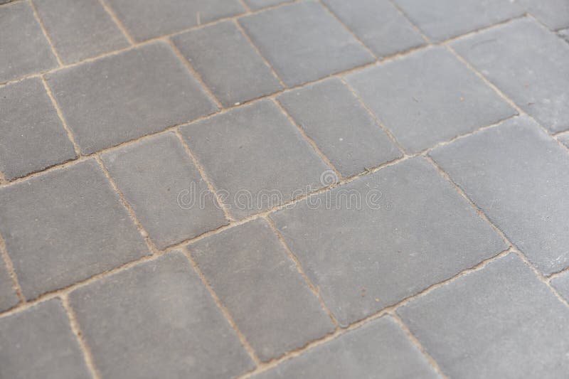Gray Pavement Tiles in the Street Creating a Regular Grid and Texture ...