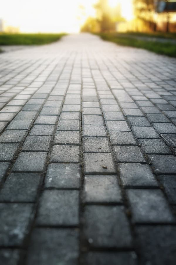 Gray Paving Stone Path Goes Away the Prospect in Sunset Stock Photo ...