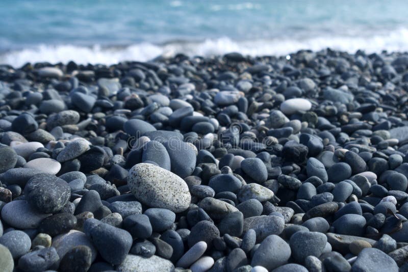Gray pebbles on sea beach stock image. Image of stones - 243249563