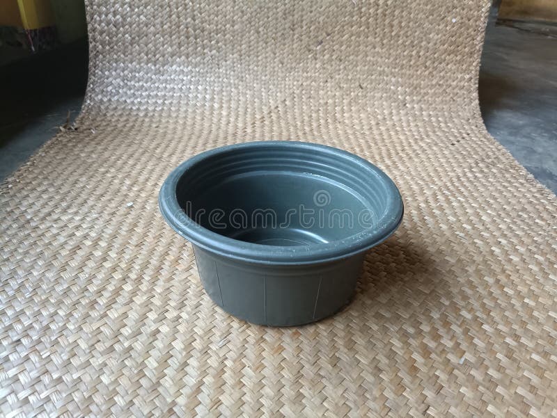 Gray Plastic Basin on a Woven Pandan Leaf Mat Stock Photo - Image of ...